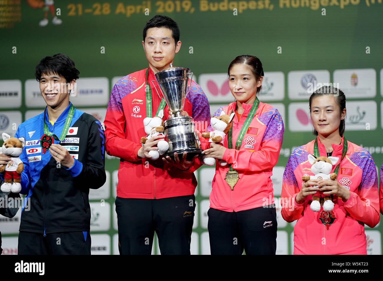 Xu Xin and Liu Shiwen of China poses with their trophy after defeating ...