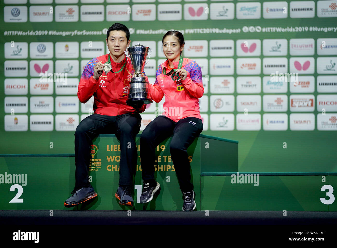 Xu Xin and Liu Shiwen of China poses with their trophy after defeating ...