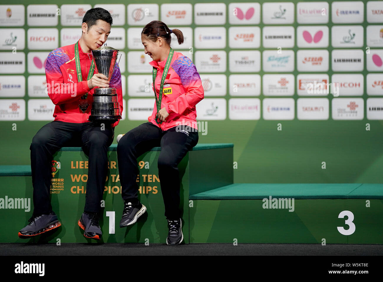 Xu Xin and Liu Shiwen of China poses with their trophy after defeating ...