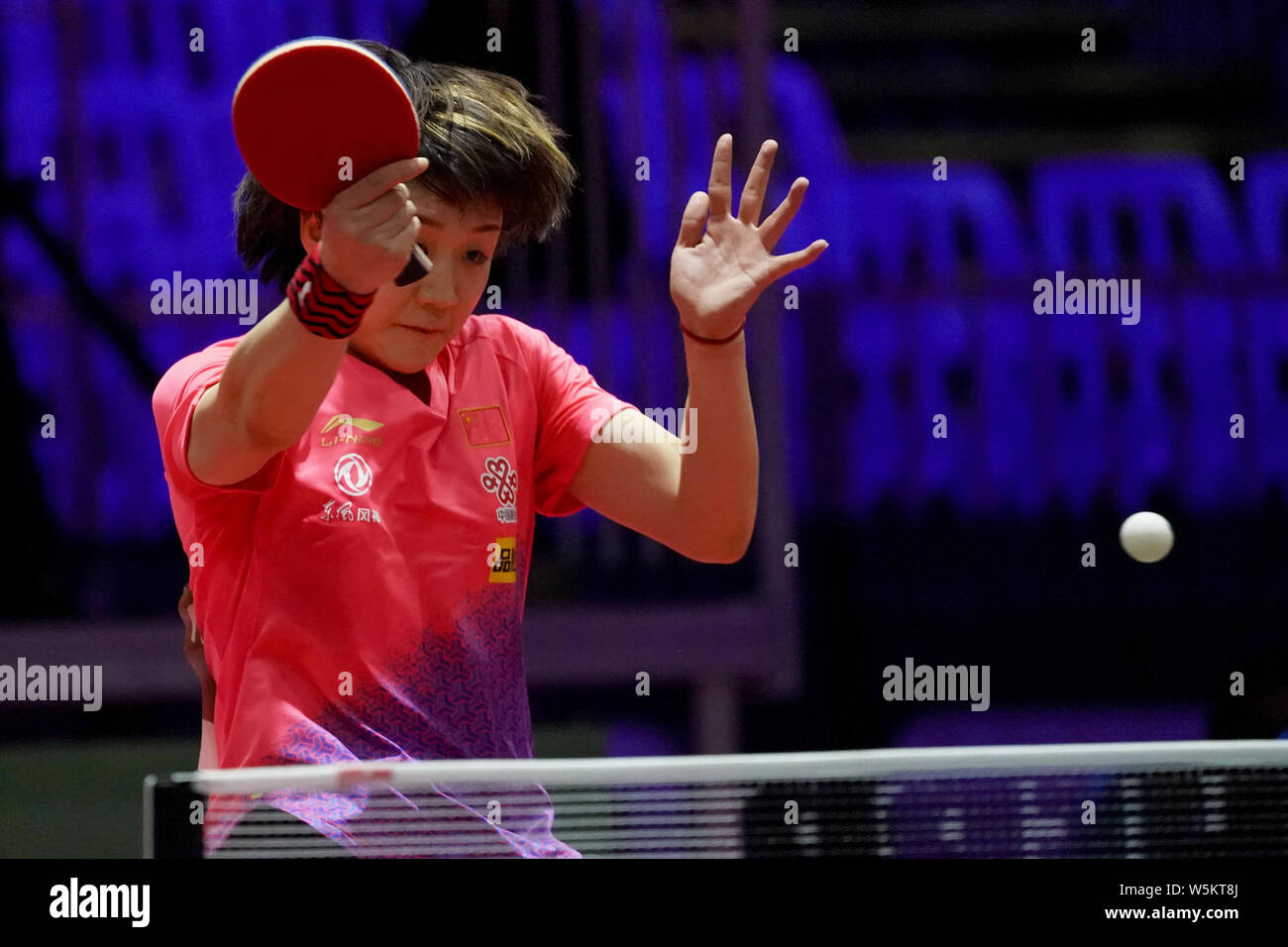 Chen Meng of China returns a shot to Doo Hoi Kem of Hong Kong in their ...