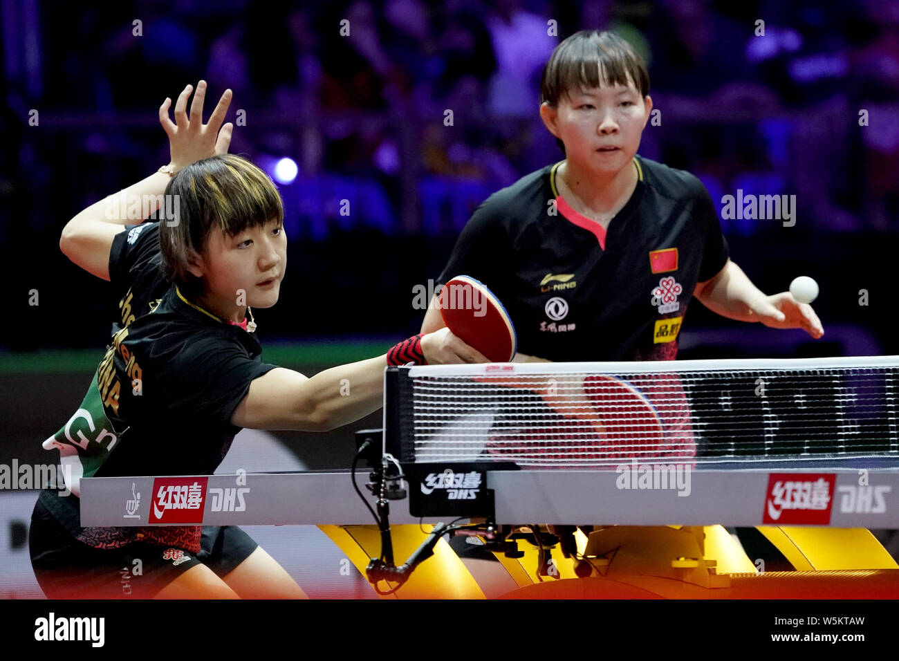 Chen Meng and Zhu Yuling of China return a shot to Doo Hoi Kem and Lee ...