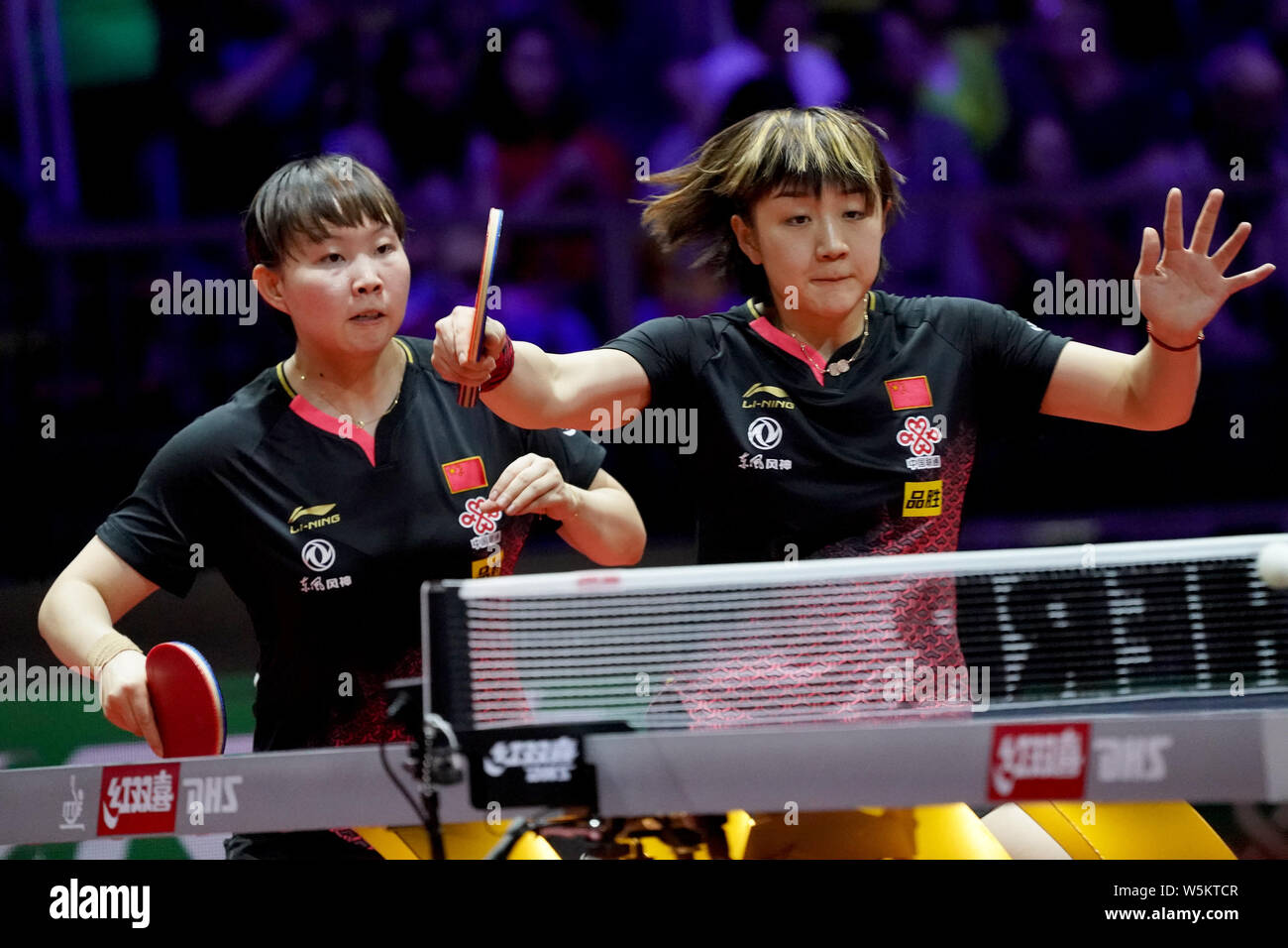 Chen Meng and Zhu Yuling of China return a shot to Doo Hoi Kem and Lee ...