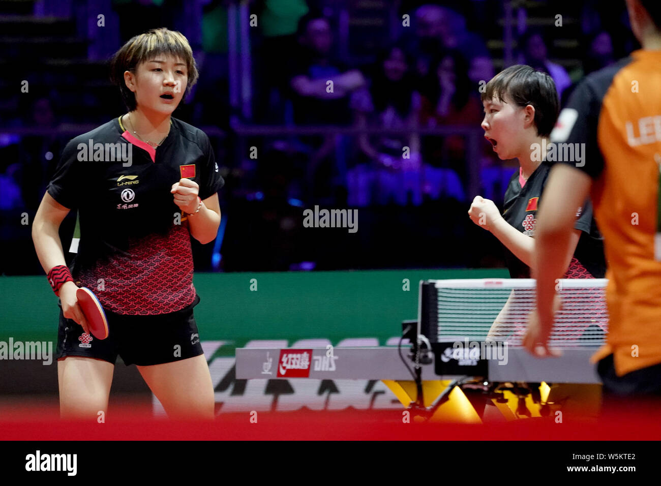 Chen Meng and Zhu Yuling of China celebrate after scoring against Doo Hoi Kem and Lee Ho Ching ...