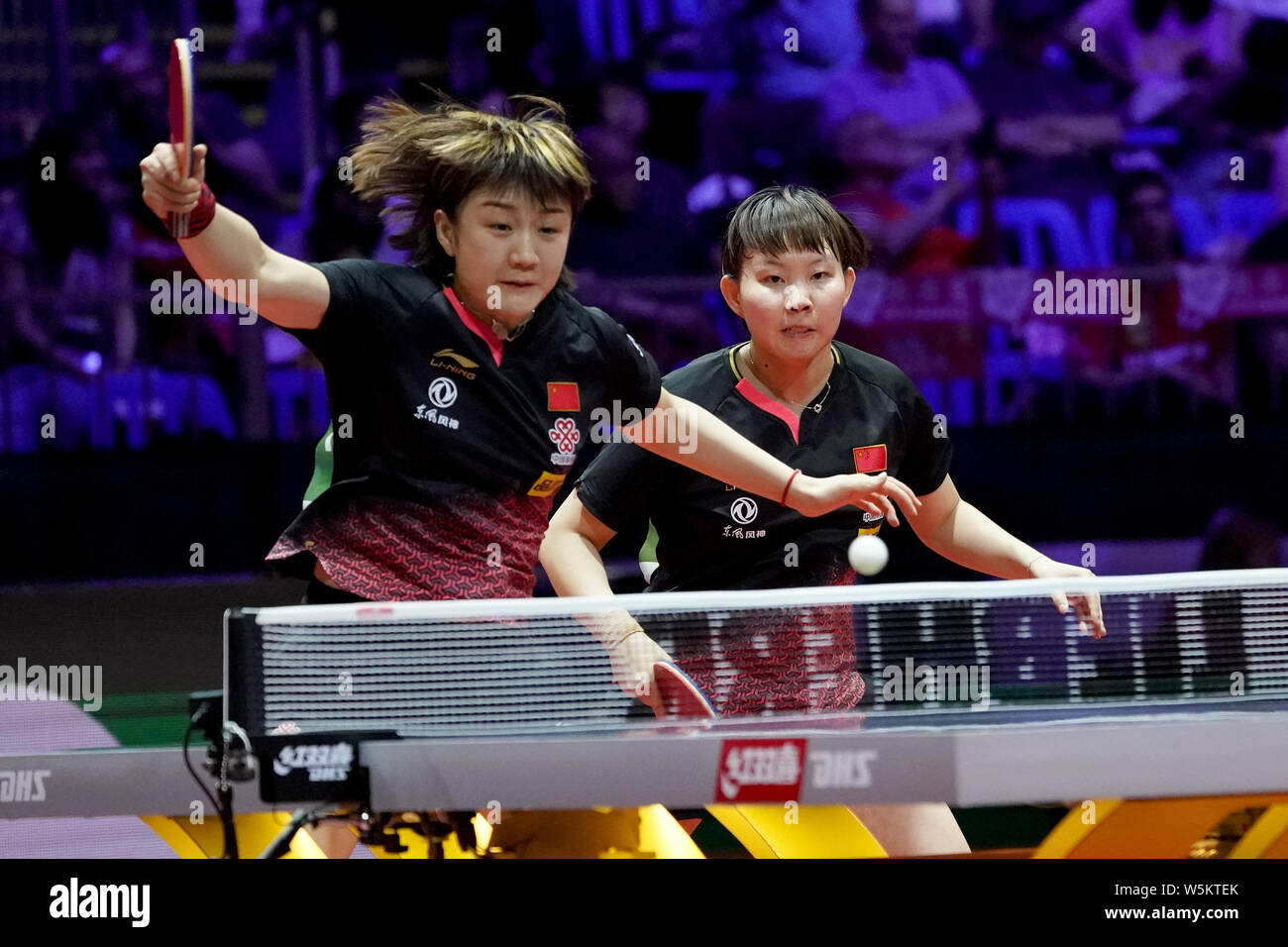 Chen Meng and Zhu Yuling of China return a shot to Doo Hoi Kem and Lee ...