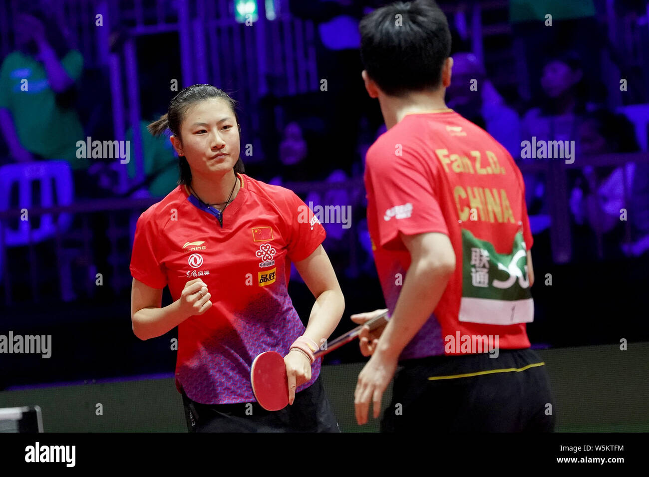 Fan Zhendong and Ding Ning of China celebrate after scoring against Ho ...