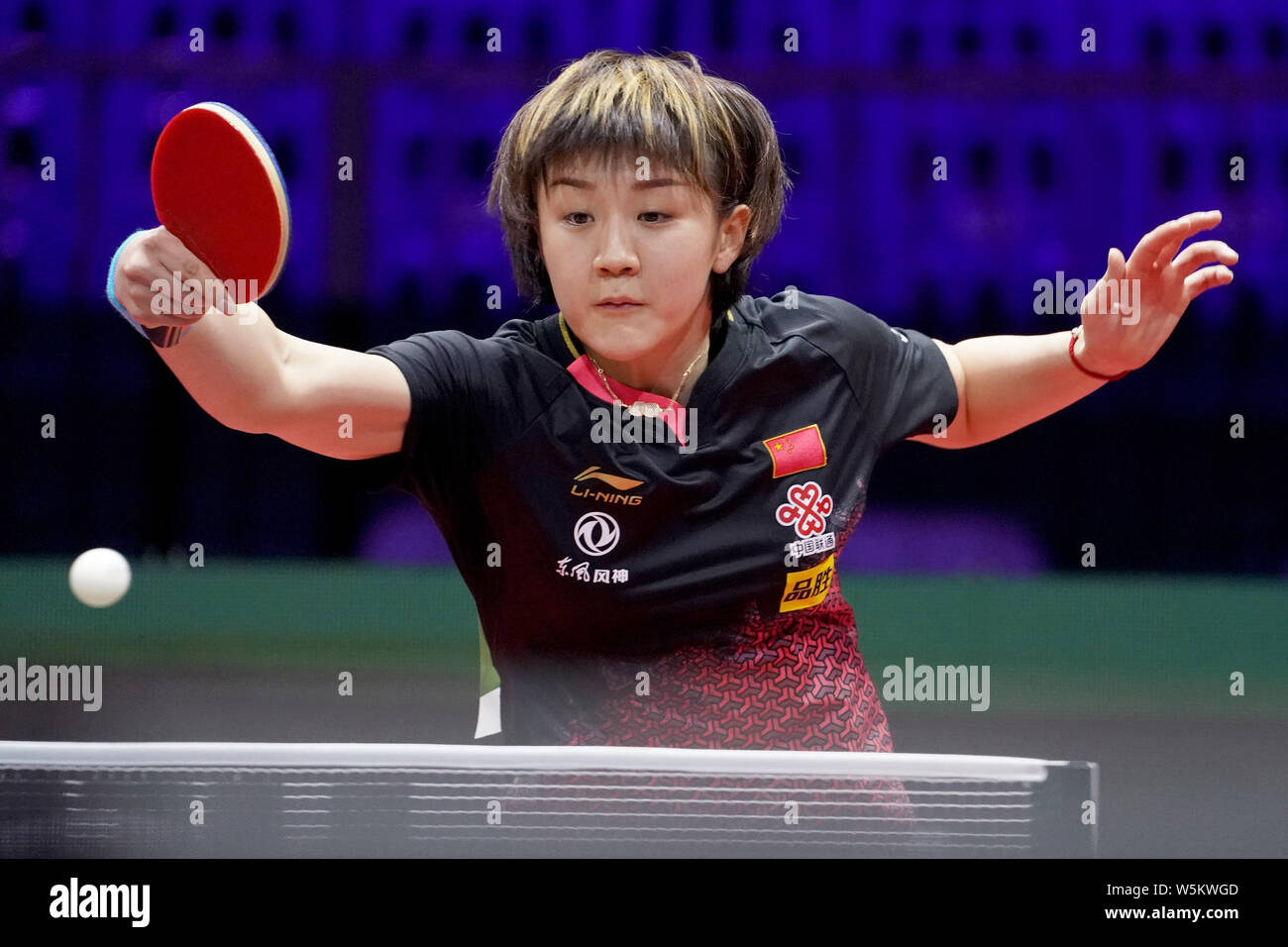 Chen Meng of China returns a shot to Wong Xin Ru of Singapore in their ...