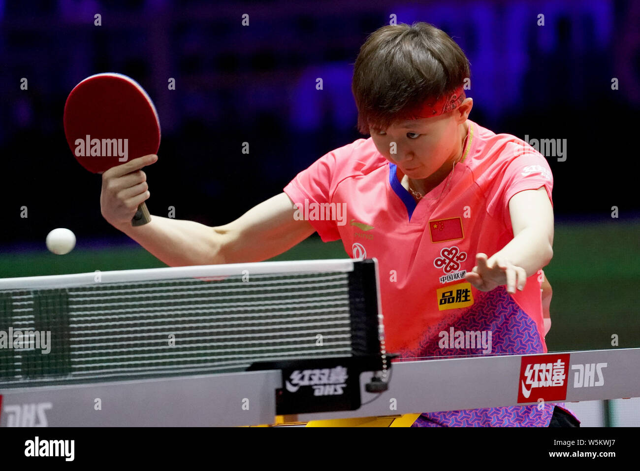 Wang Manyu of China returns a shot to Sarah Hanffou of Cameroon in ...