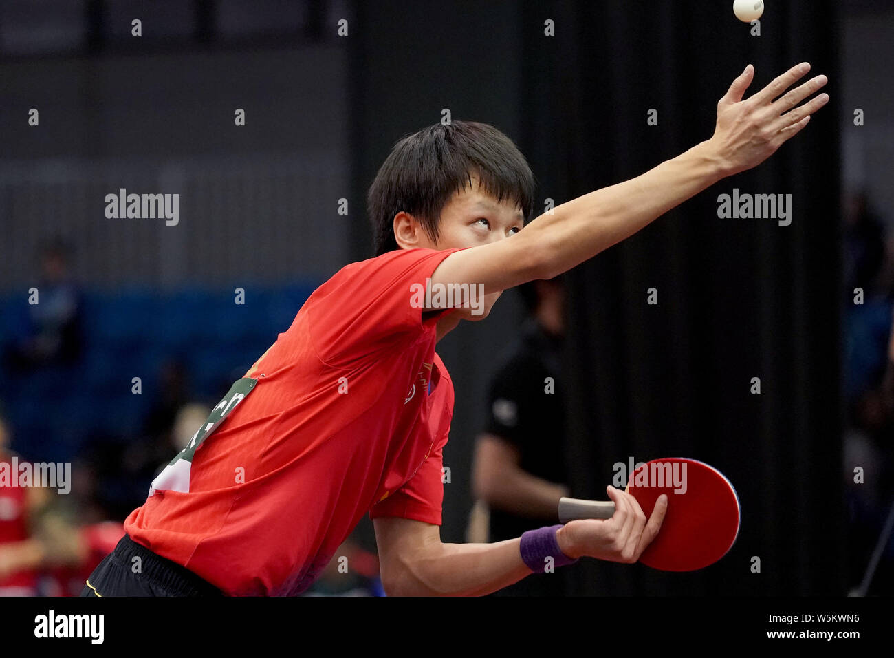 Lin Gaoyuan Of China Serves Against Omri Ben Ari And Michael Tauber Of Israel In Their First