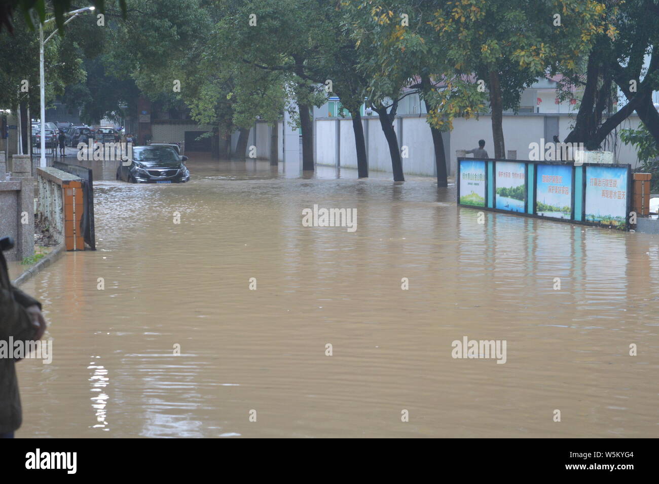 Chinese rescuers evacuate local residents in floodwater after a heavy ...