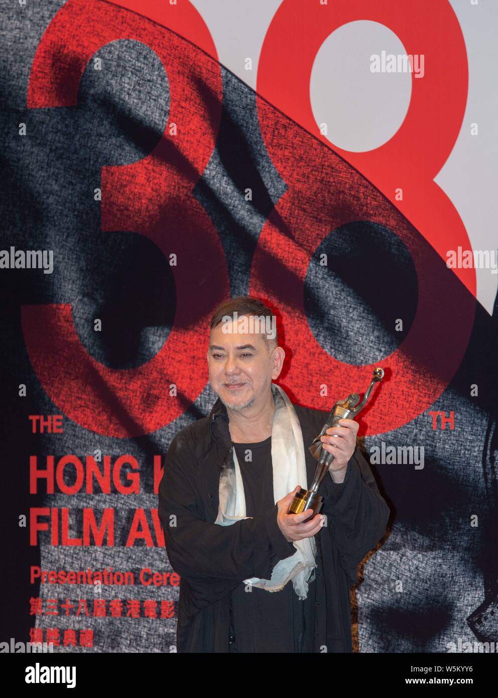 Hong Kong actor Anthony Wong poses with his trophy after winning "Best ...