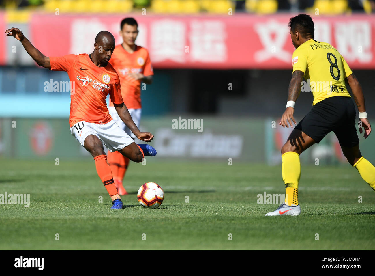 English football player Sone Aluko of Beijing Renhe dribbles against ...