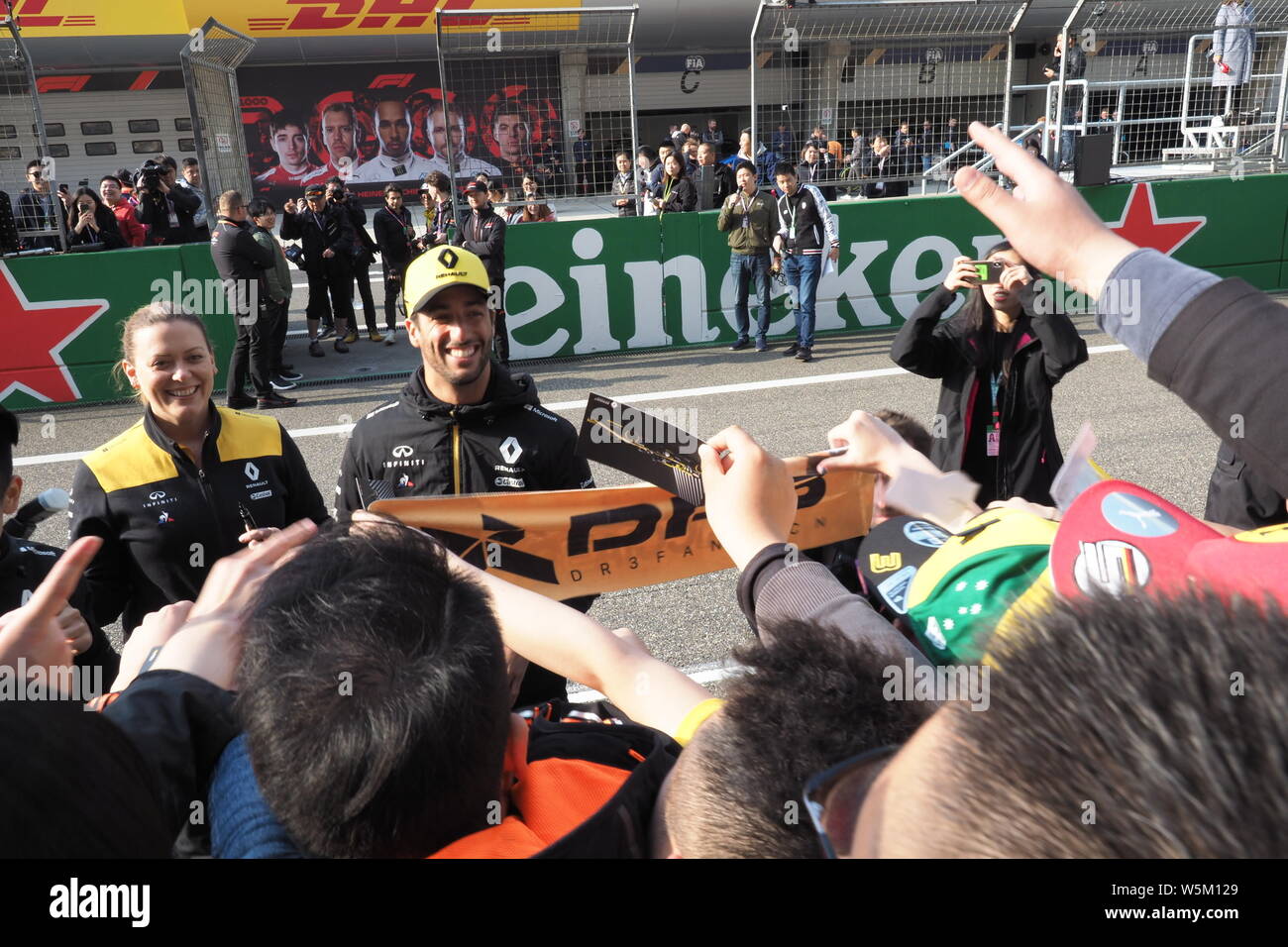 Australian racing driver Daniel Ricciardo of Renault F1 Team, signs ...