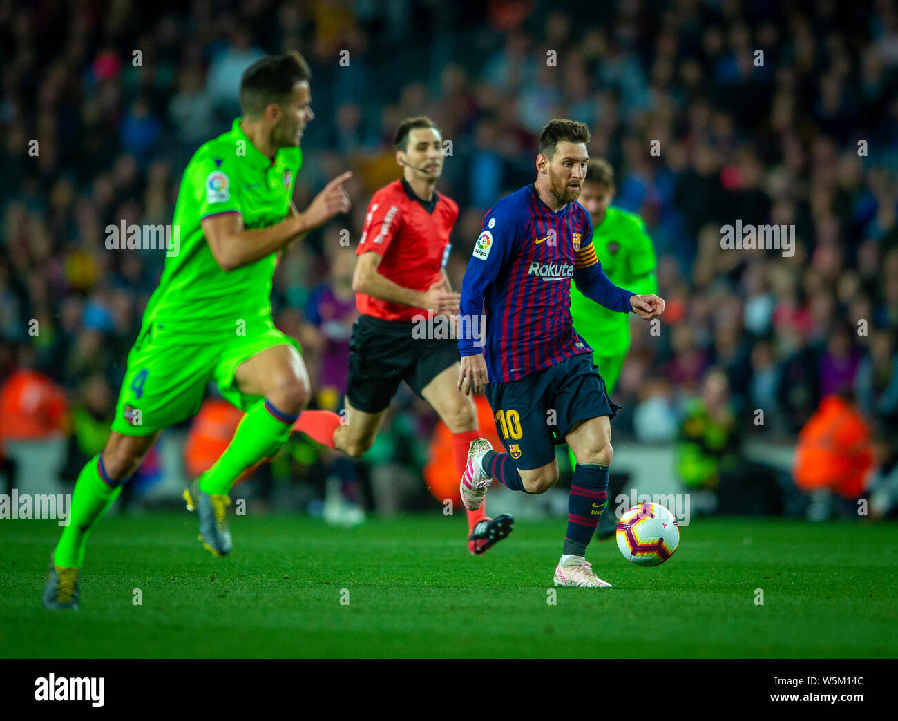 Lionel Messi of FC Barcelona dribbles during their 35th round match of ...