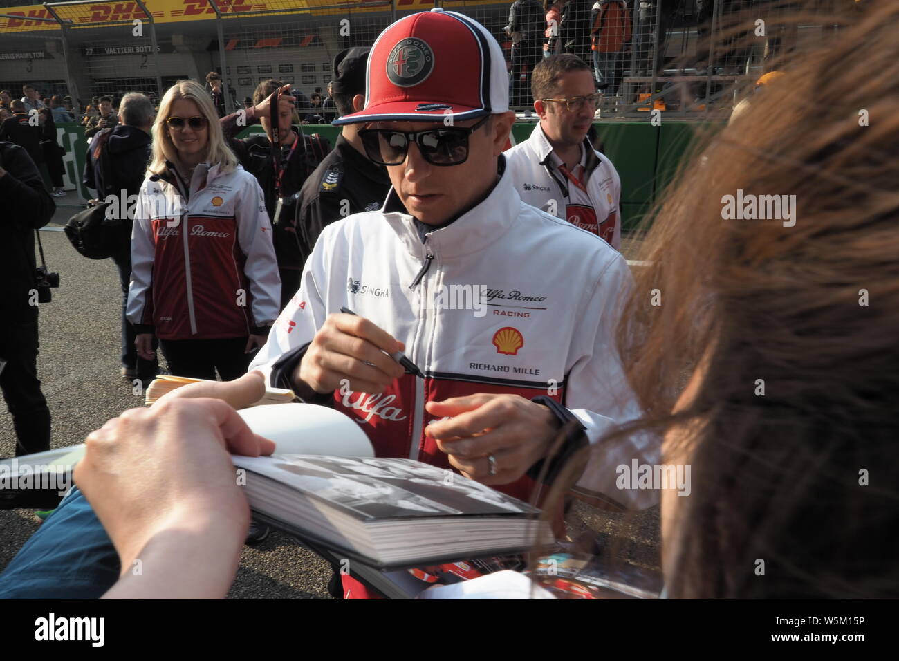 Finnish racing driver Kimi Raikkonen of Alfa Romeo Racing, signs ...