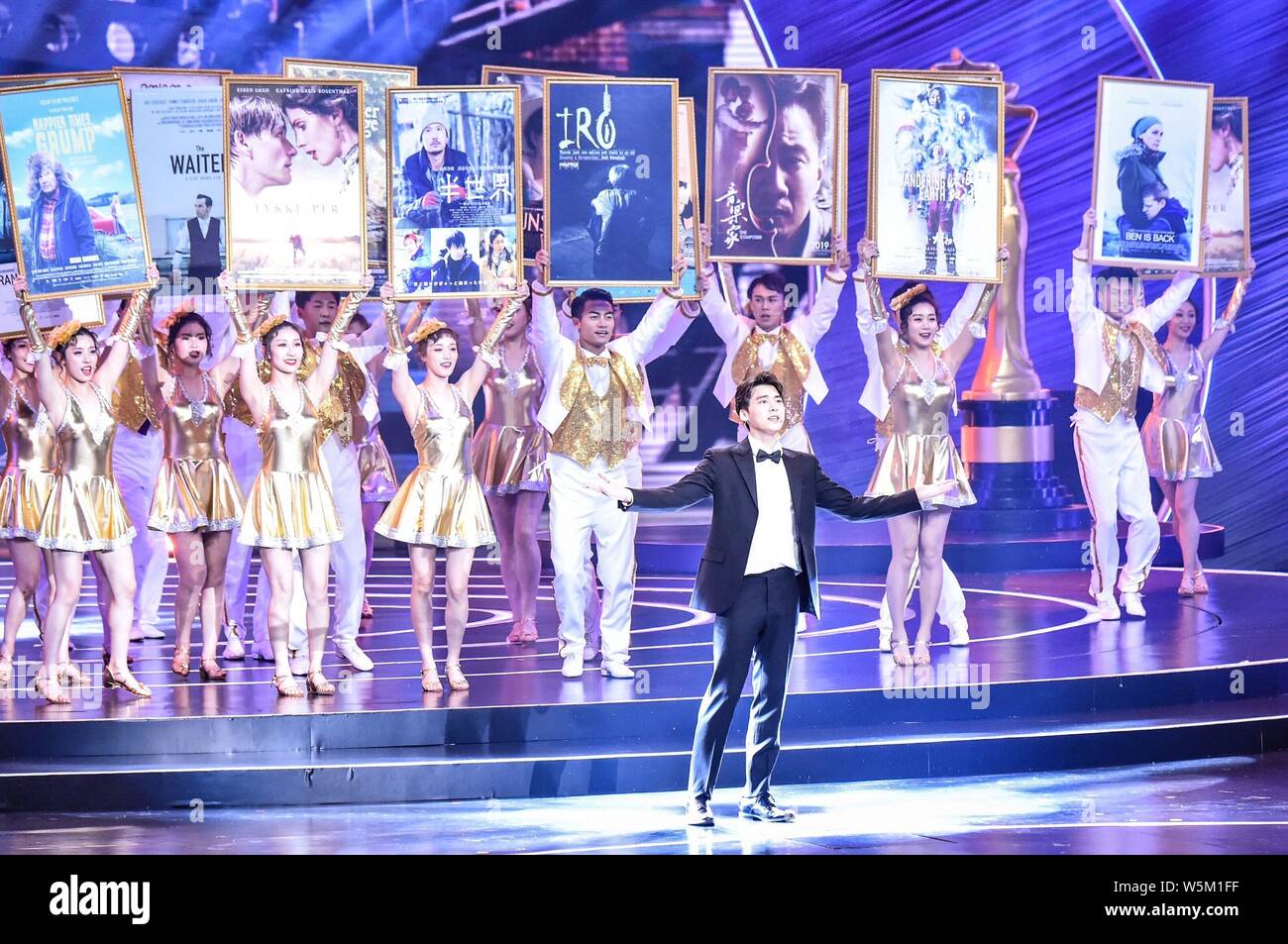 Chinese actor and singer Li Yifeng performs during the closing and award presentation ceremony ...