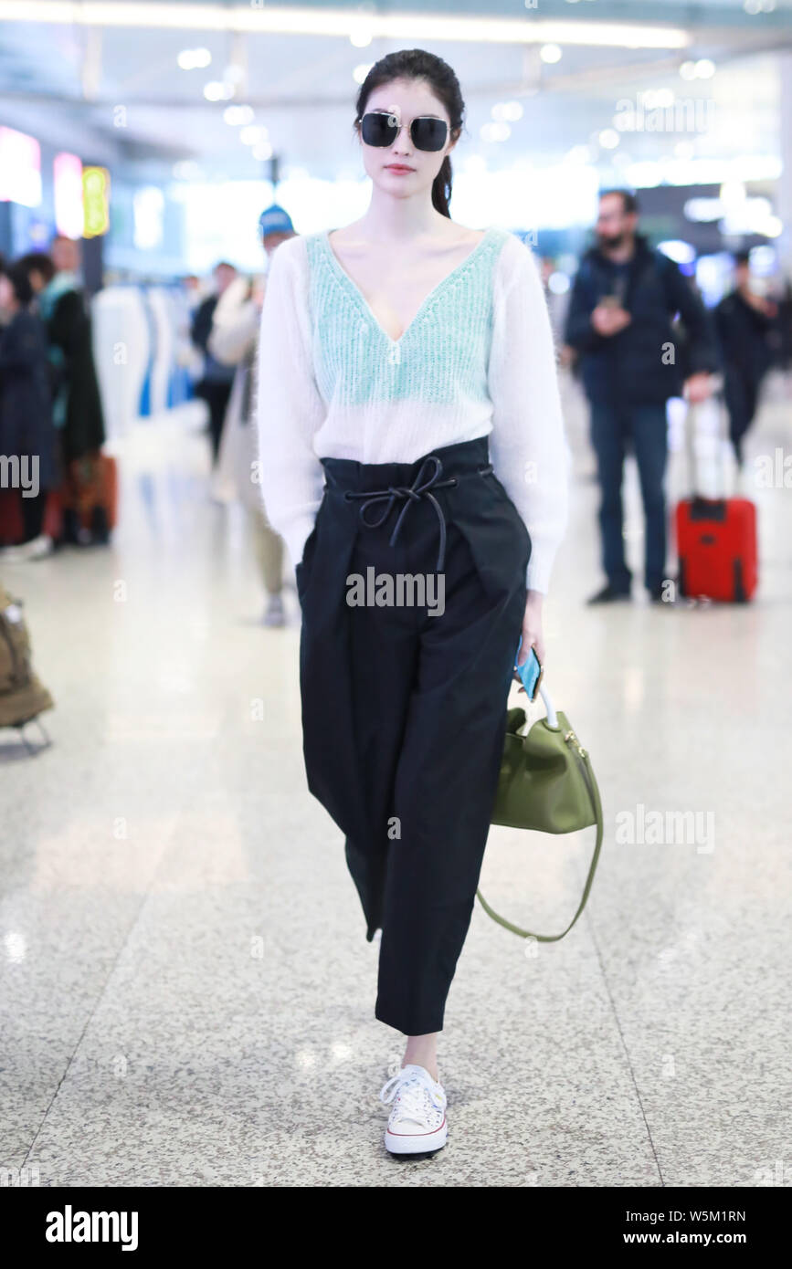 Chinese model He Sui arrives at the Shanghai Hongqiao International ...
