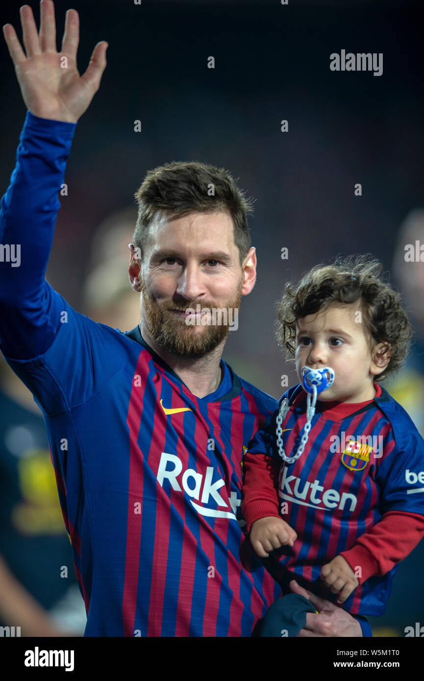 Lionel Messi of FC Barcelona holds his son Ciro after his team defeated ...