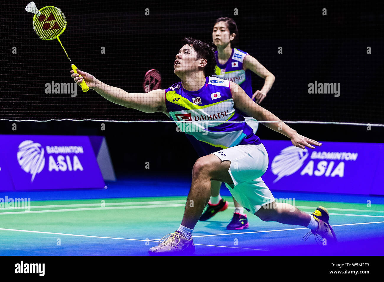 Kohei Gondo returns a shot to Sachin Dias and Thilini Pramodika ...