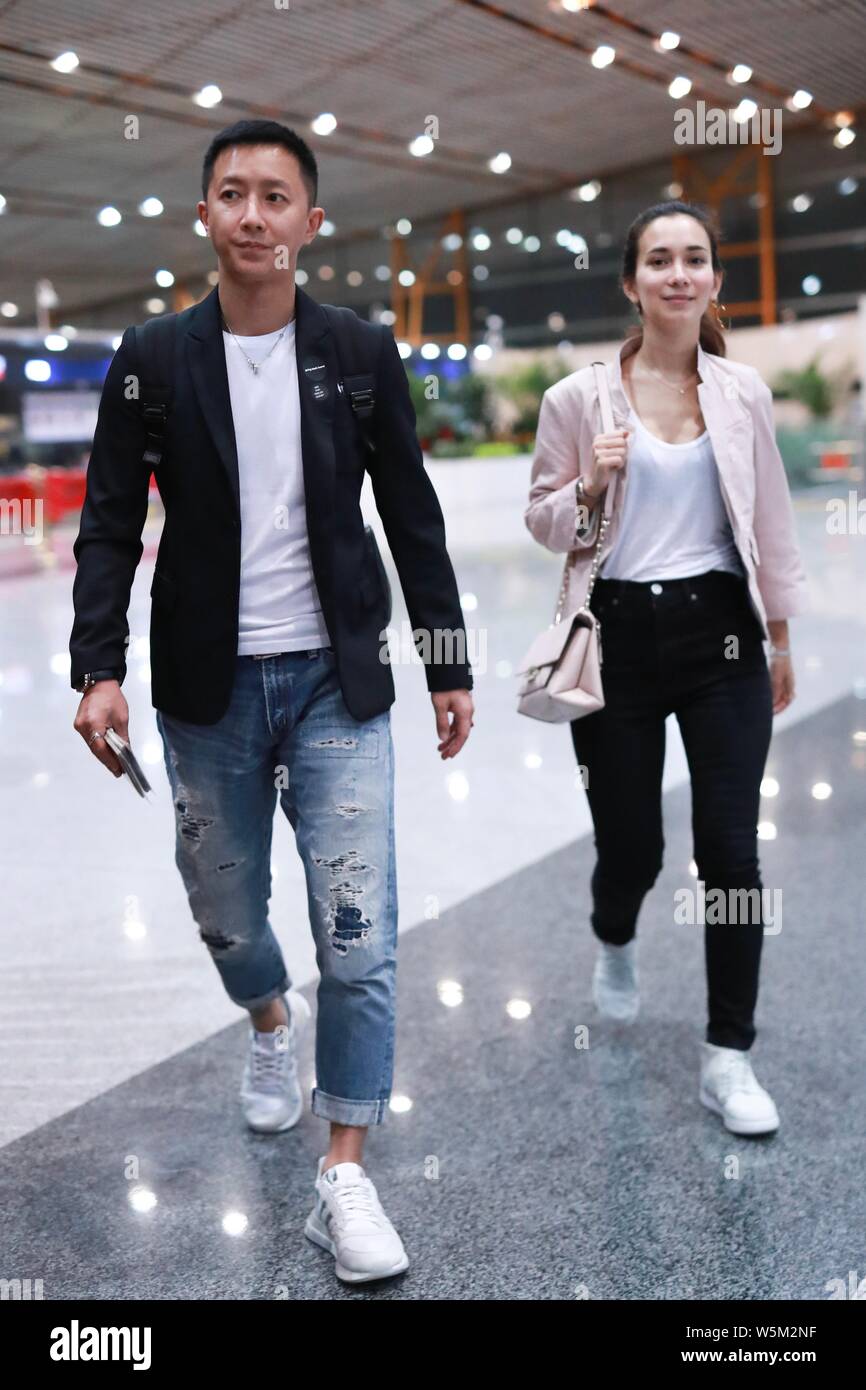 Chinese actor Han Geng, left, and his American actress girlfriend Celina Jade arrive at the ...
