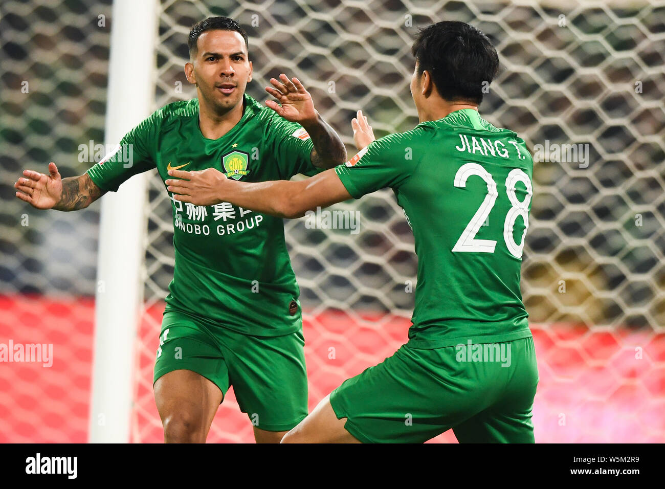 Spanish football player Jonathan Viera, left, of Beijing Sinobo Guoan ...