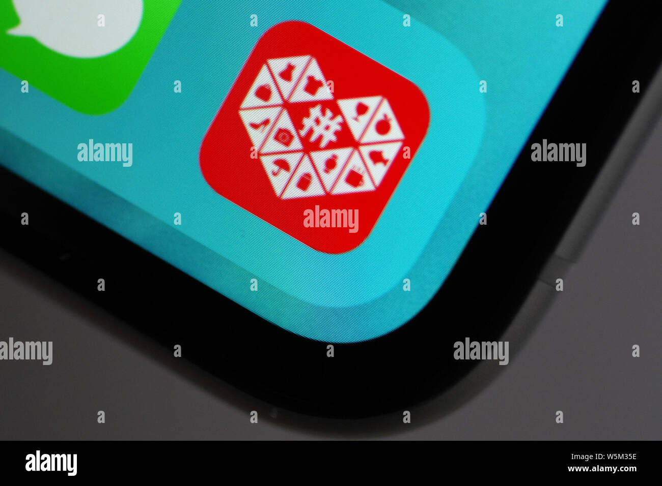 A netizen shows the icon of Chinese social e-commerce giant Pinduoduo ...