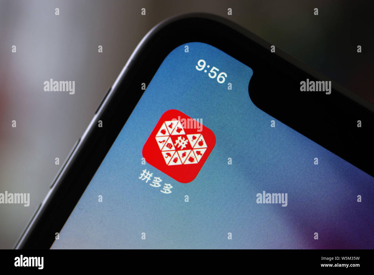 A netizen shows the icon of Chinese social e-commerce giant Pinduoduo ...