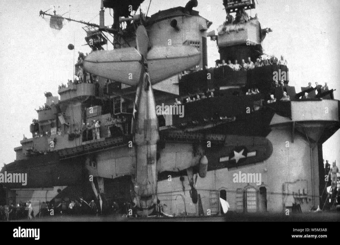 Curtiss SB2C Helldiver is stopped by the crash barrier aboard USS ...