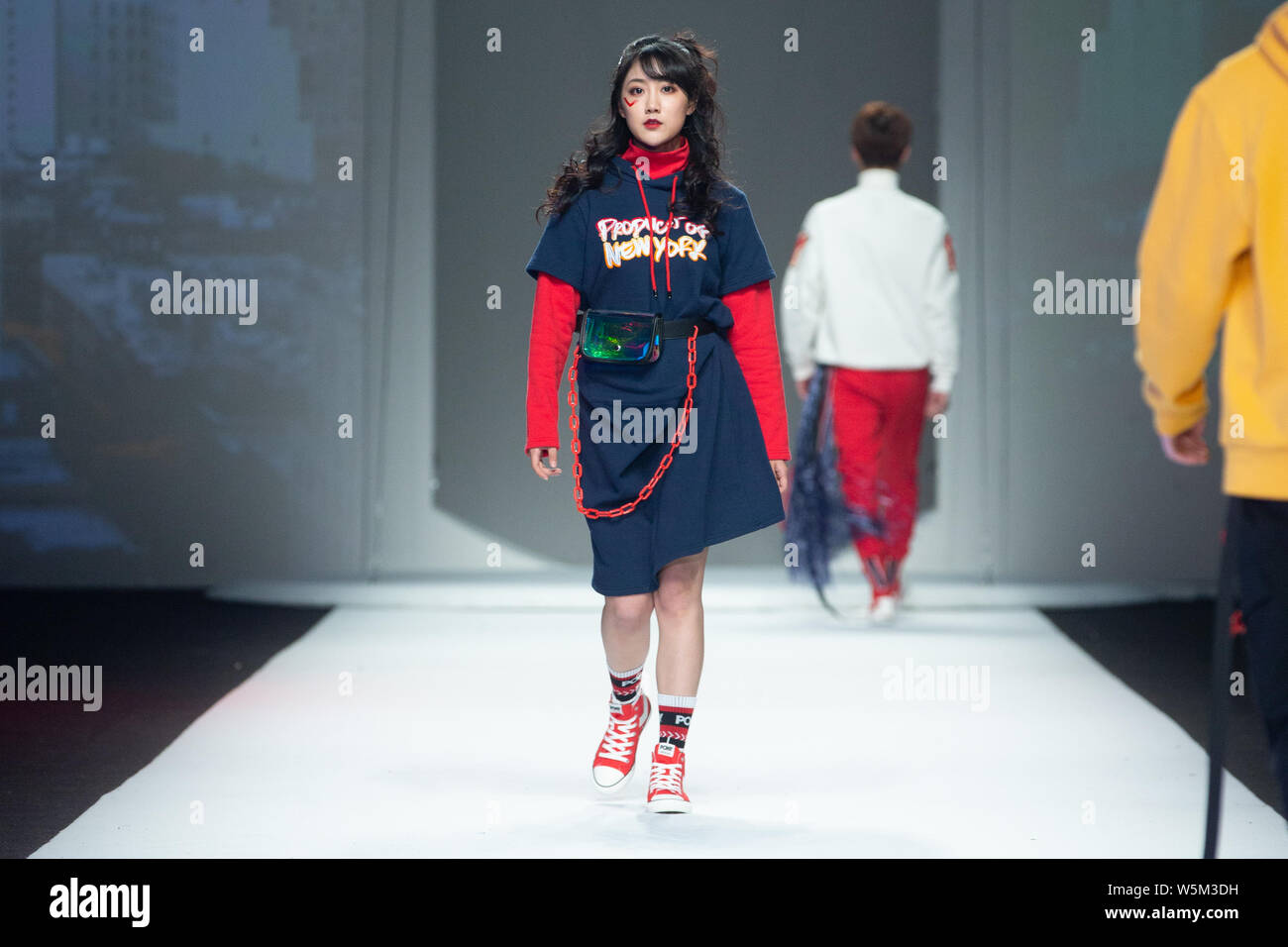 Singer Li Yitong of Chinese idol group SNH48 displays a new creation at ...