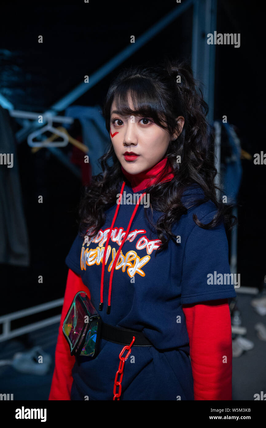 Singer Li Yitong of Chinese idol group SNH48 displays a new creation at ...