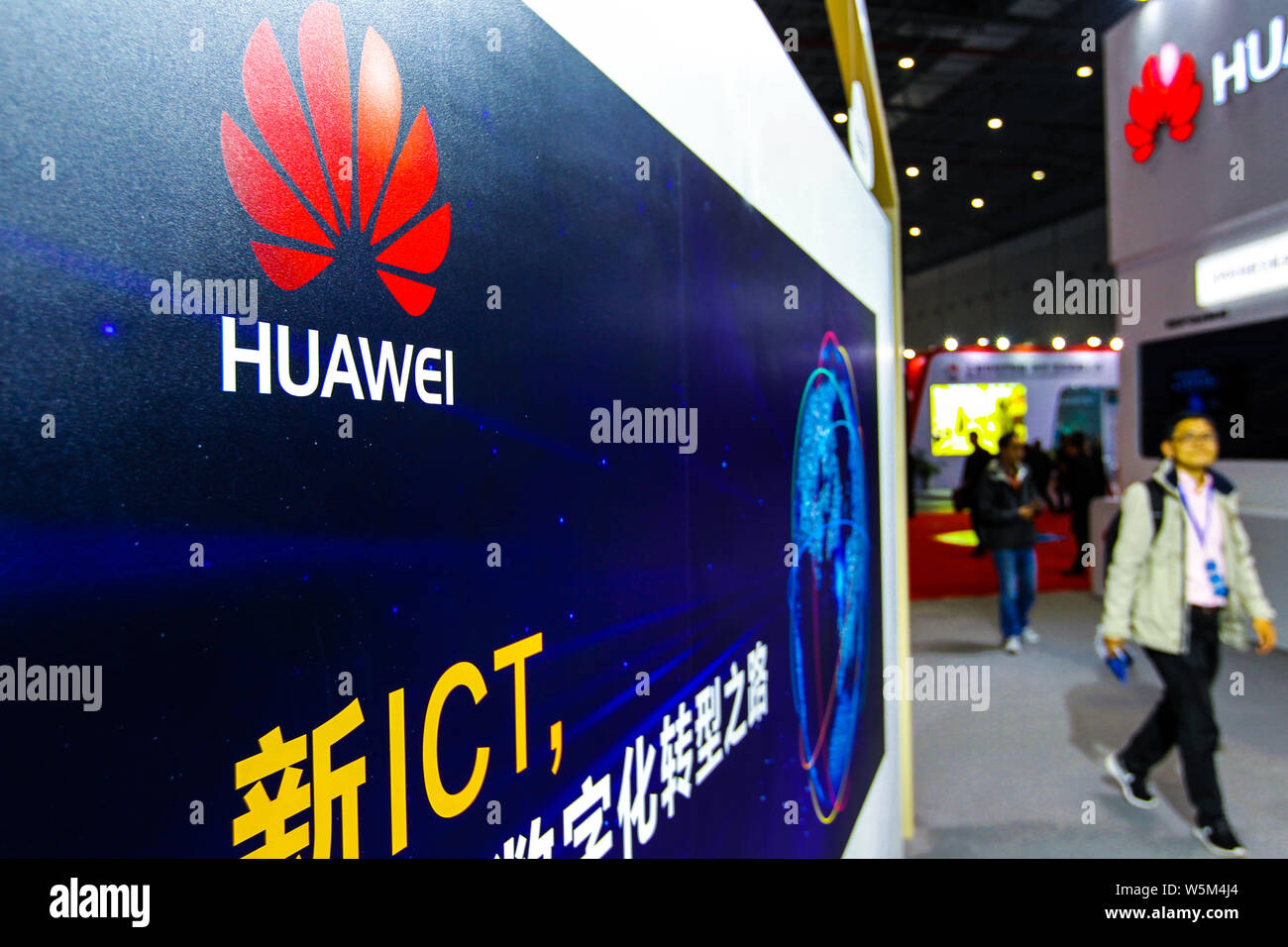 --FILE--People visit the stand of Huawei during an exhibition in ...