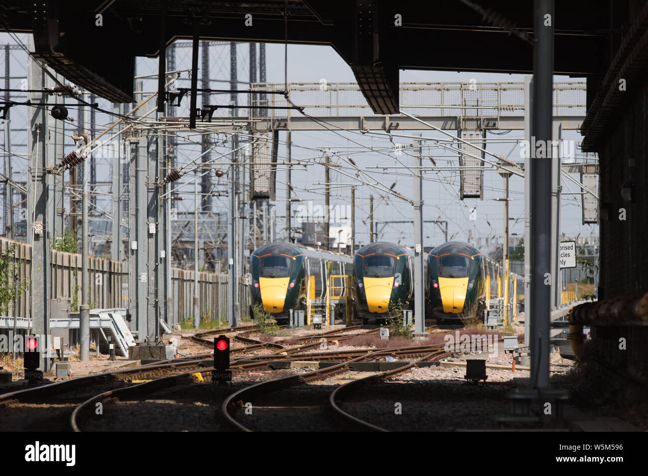 Three trains next to each other Stock Photo - Alamy