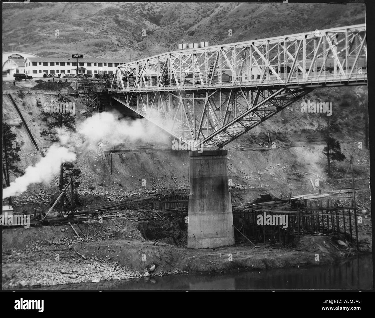 Driving wood piling for working platform in enlarging highway bridge ...