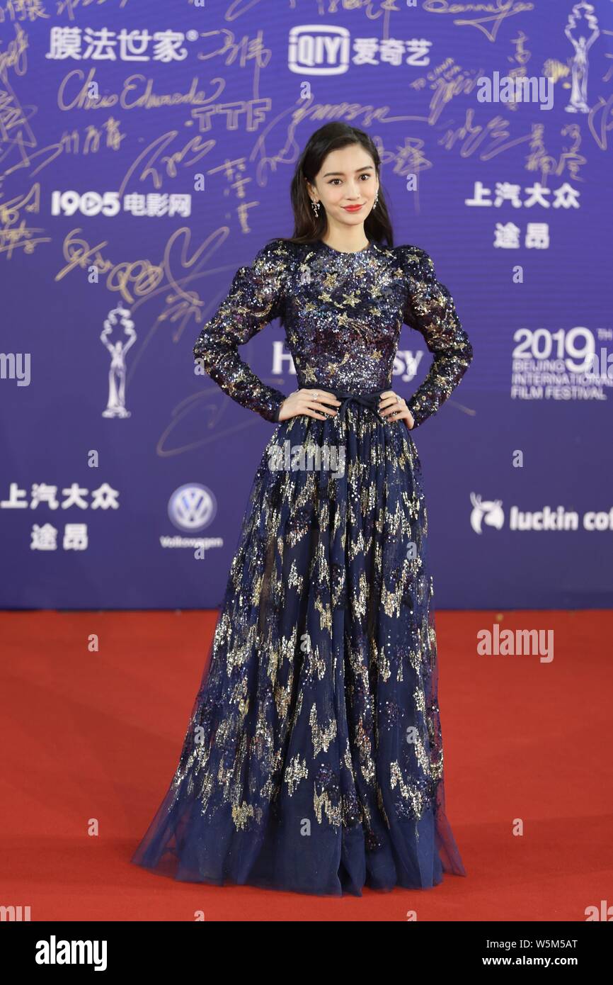 Hong Kong actress Angelababy poses as she arrives on the red carpet for the opening ceremony of ...