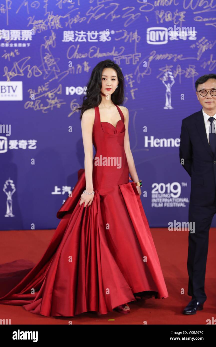 Chinese actress Chen Duling poses as she arrives on the red carpet for the opening ceremony of ...