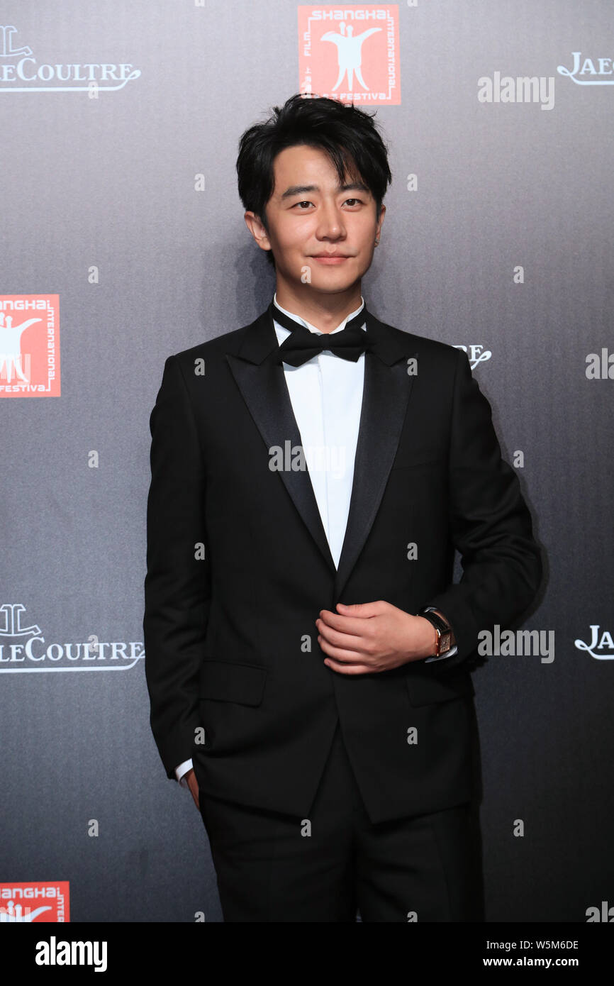 --FILE--Chinese actor Huang Xuan arrives on the red carpet for a dinner ...