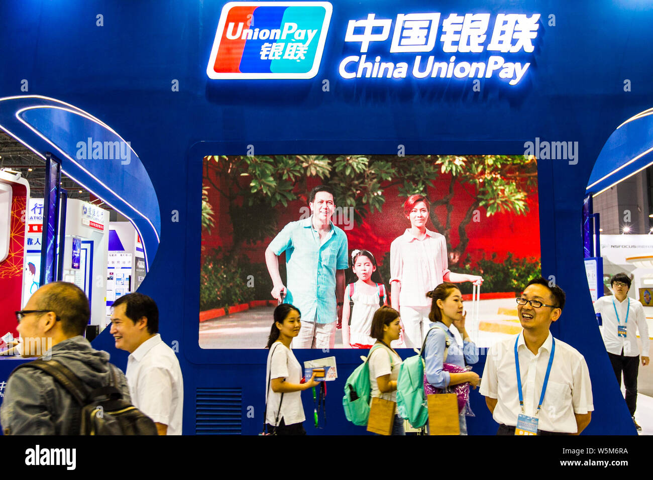 --FILE--People visit the stand of China UnionPay during an exhibition ...