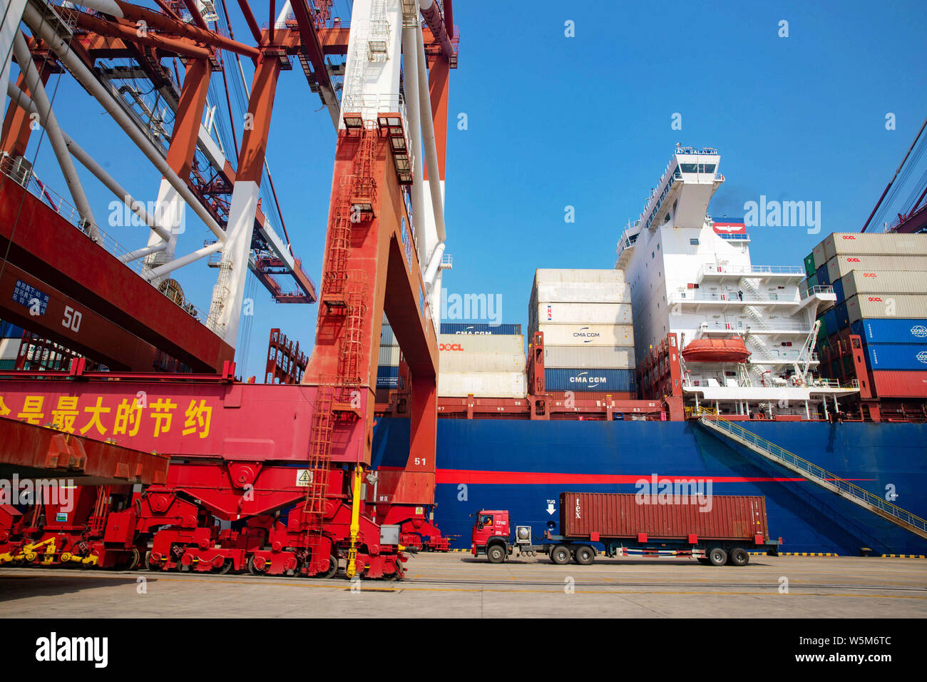 Crane vehicle lifts container hi-res stock photography and images - Alamy