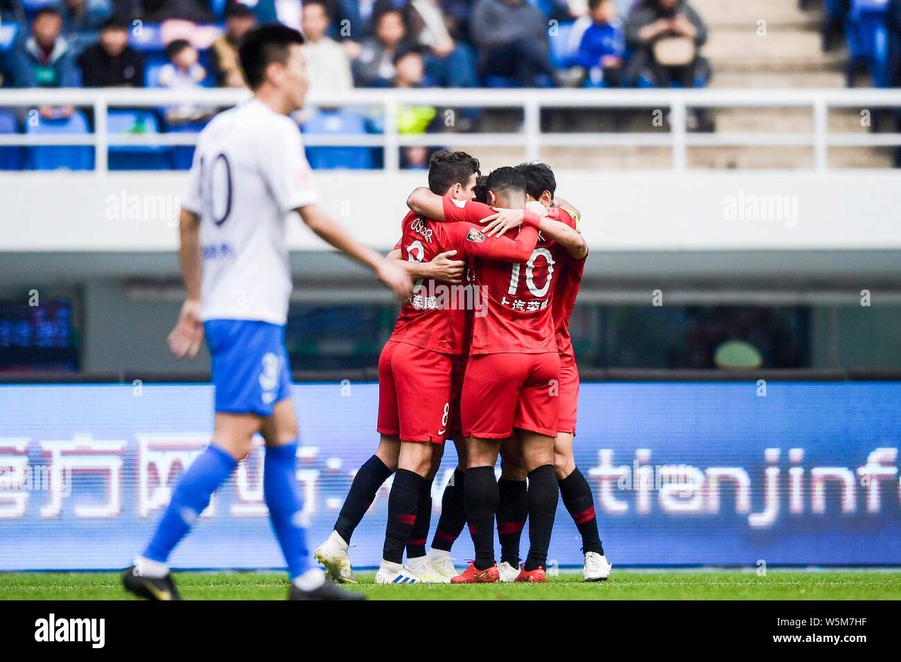 Players of Shanghai SIPG celebrate after scoring against Tianjin TEDA ...