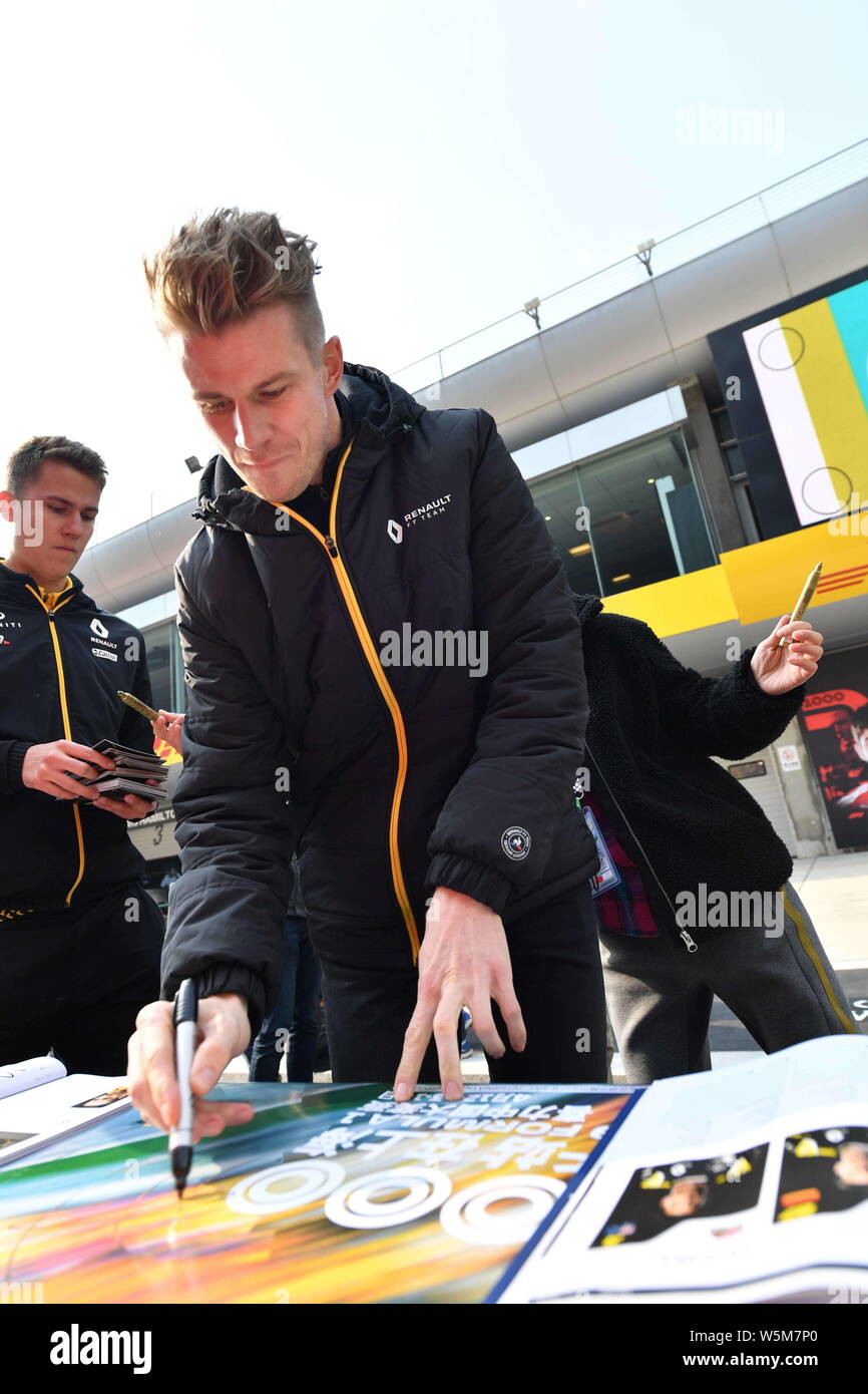 German racing driver Nico Hulkenberg of Renault F1 Team signs ...