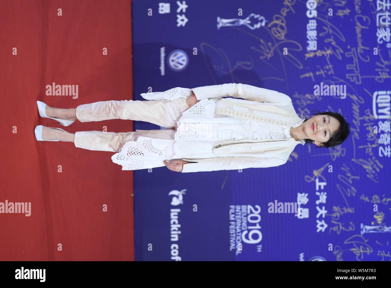 Chinese actress Zhou Dongyu poses as she arrives on the red carpet for ...