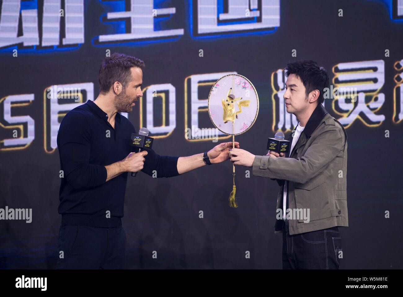 Canadian-American actor Ryan Reynolds, left, and Chinese actor Lei ...