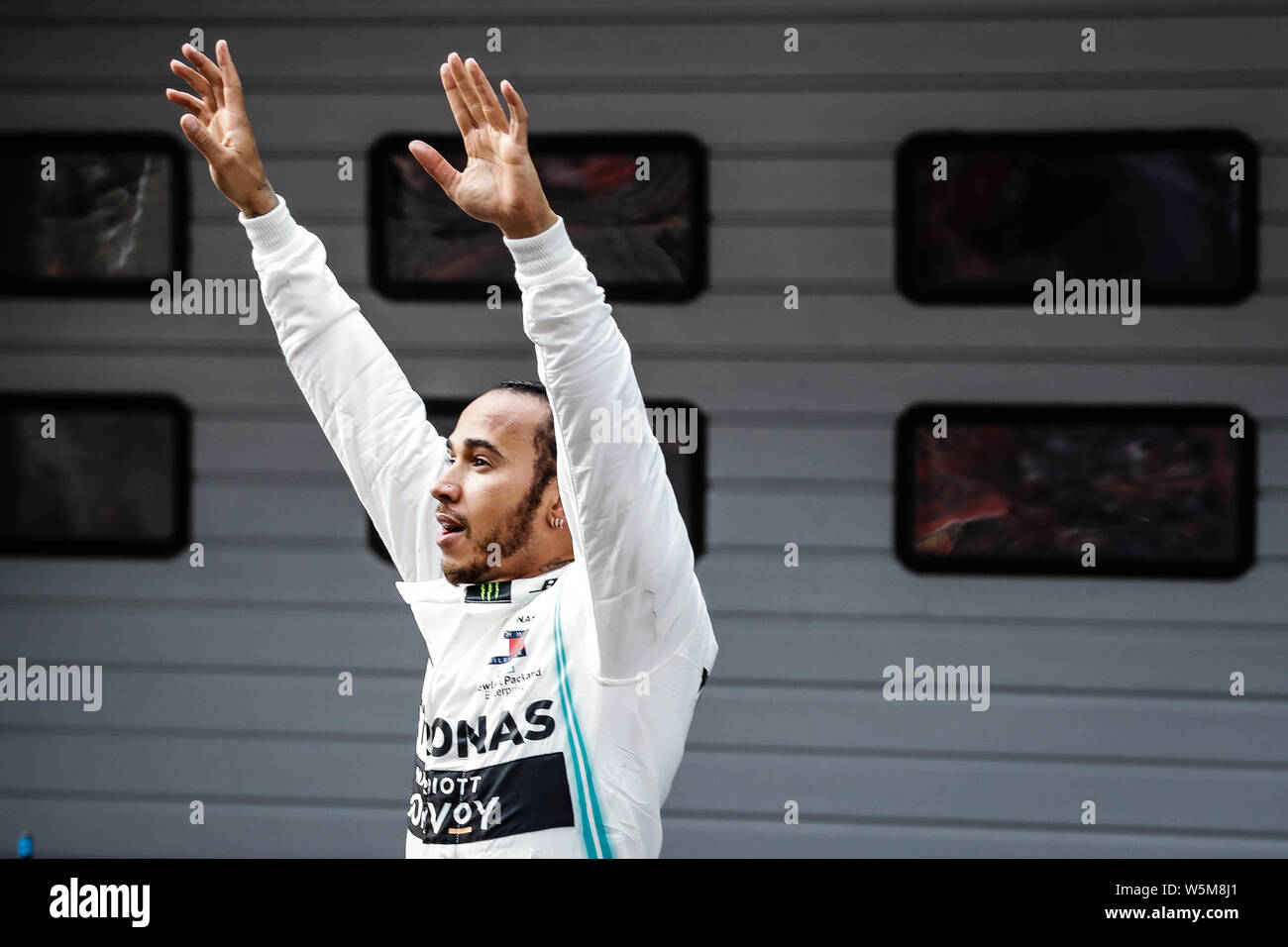 British Formula One driver Lewis Hamilton of Mercedes celebrates on the ...