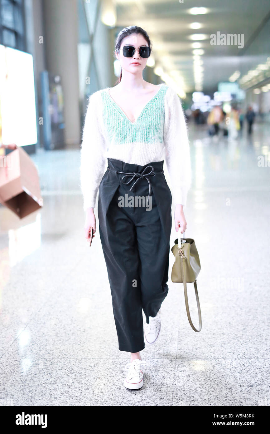 Chinese model He Sui arrives at the Shanghai Hongqiao International ...