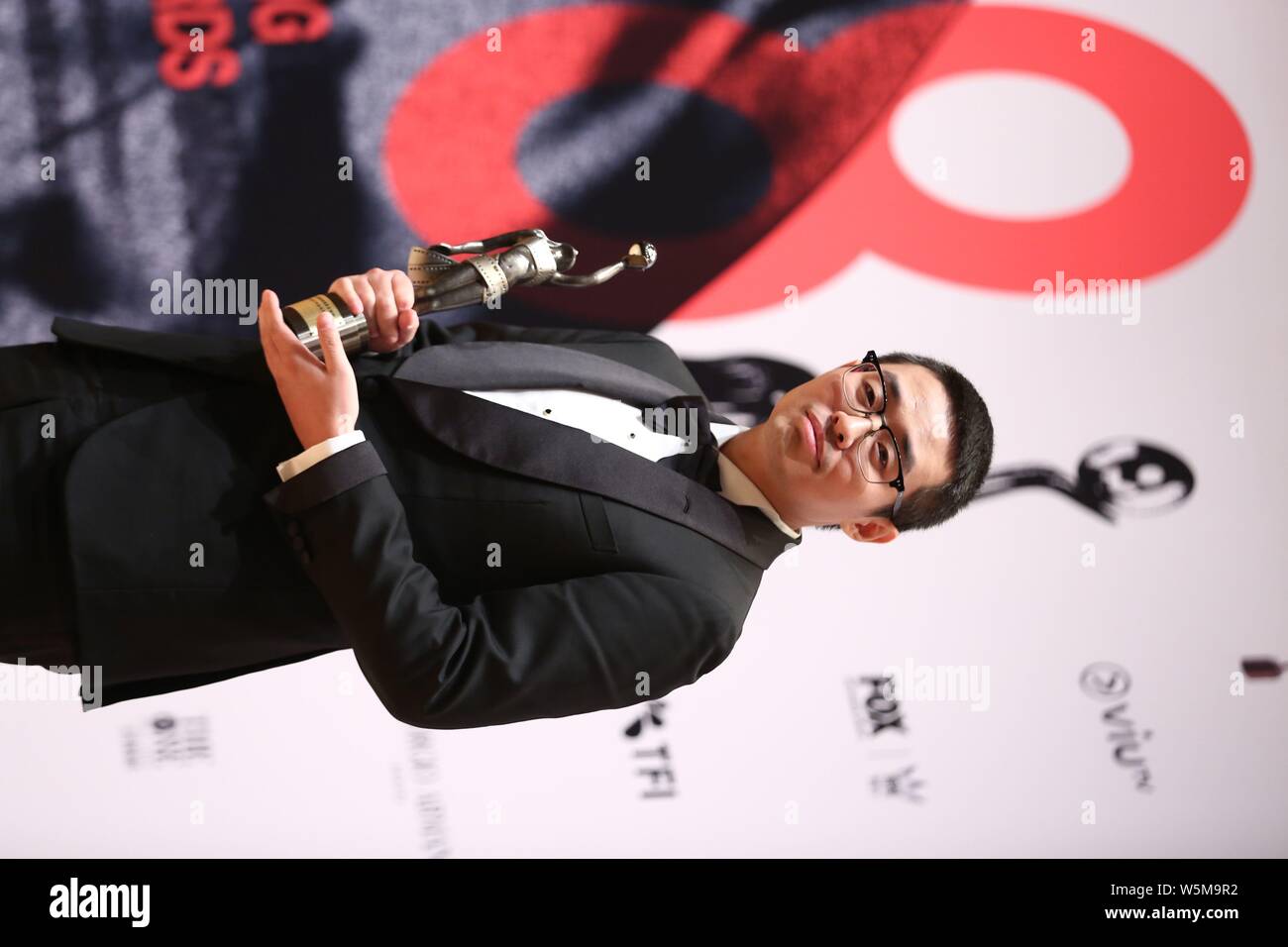 Chinese director Wen Muye poses with trophy for the "Best Film from ...