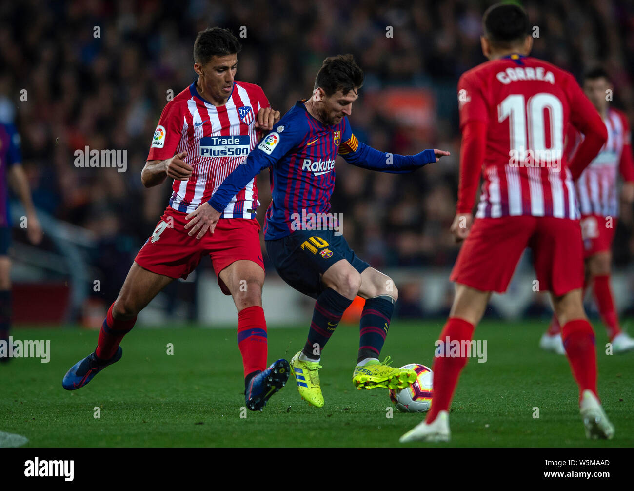 Lionel Messi of FC Barcelona, center, challenges Rodrigo, left, of Club ...