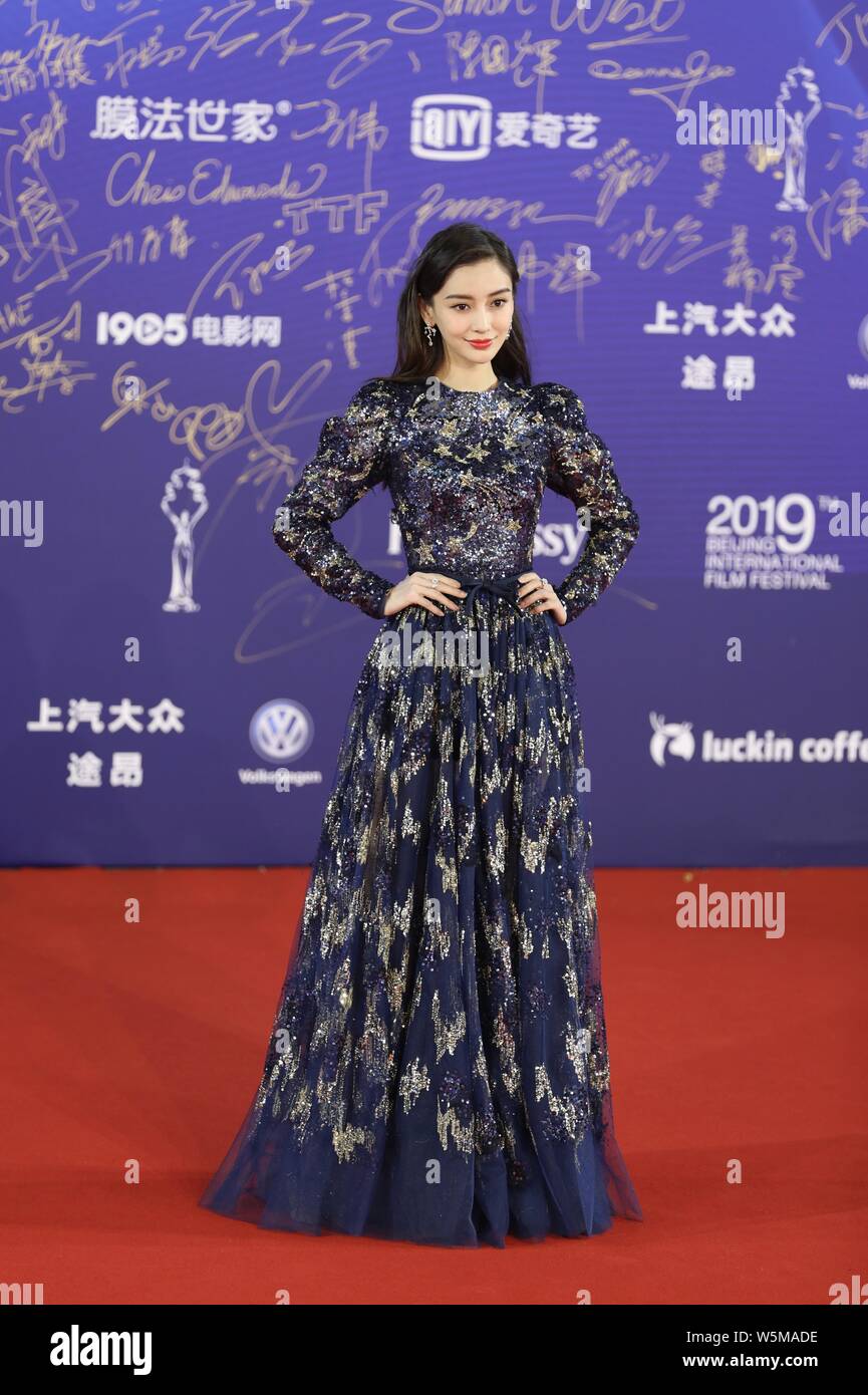 Hong Kong actress Angelababy poses as she arrives on the red carpet for the opening ceremony of ...