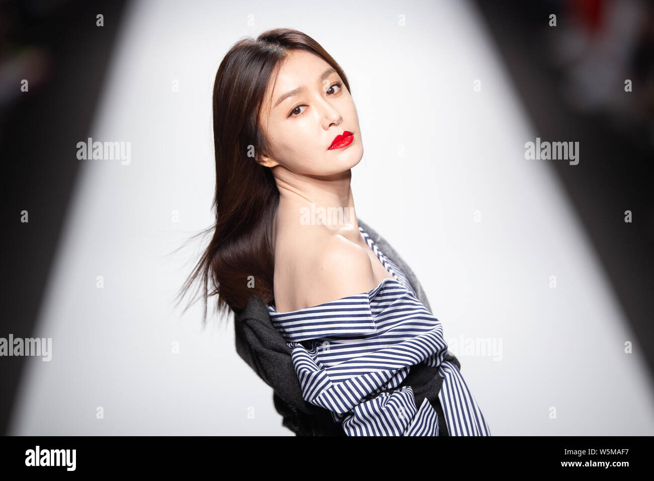 Chinese singer and actress Qin Lan displays a new creation at the Solo ...