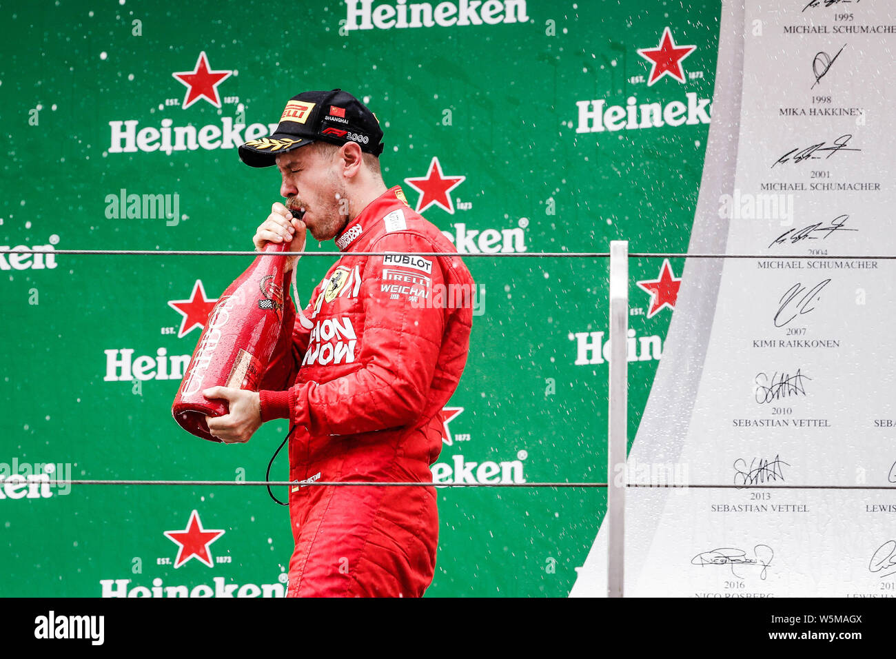 German Formula One driver Sebastian Vettel of Ferrari celebrates with ...