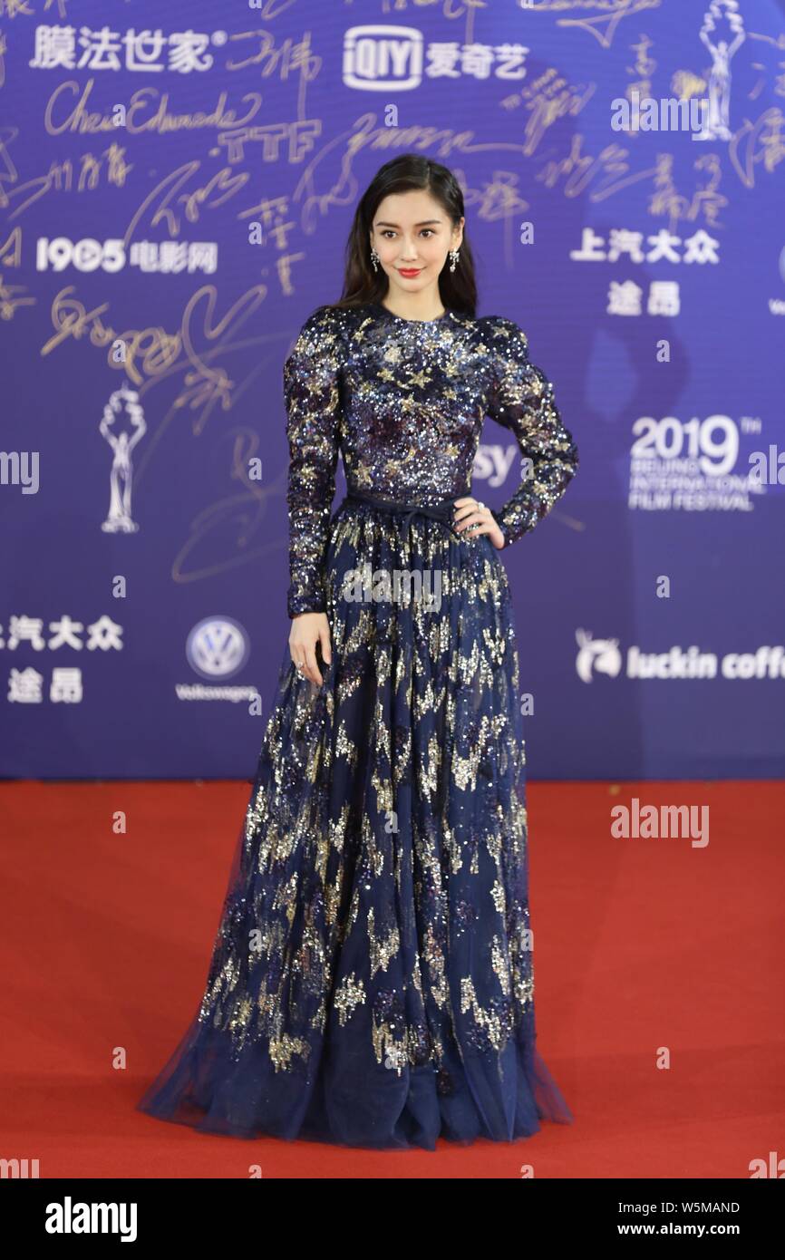 Hong Kong actress Angelababy poses as she arrives on the red carpet for the opening ceremony of ...
