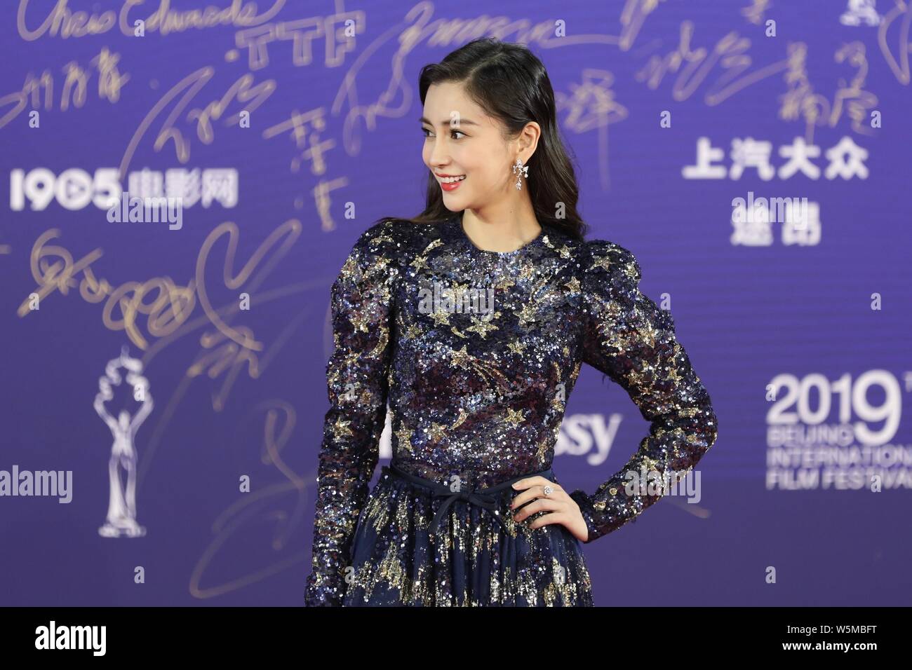 Hong Kong actress Angelababy poses as she arrives on the red carpet for the opening ceremony of ...